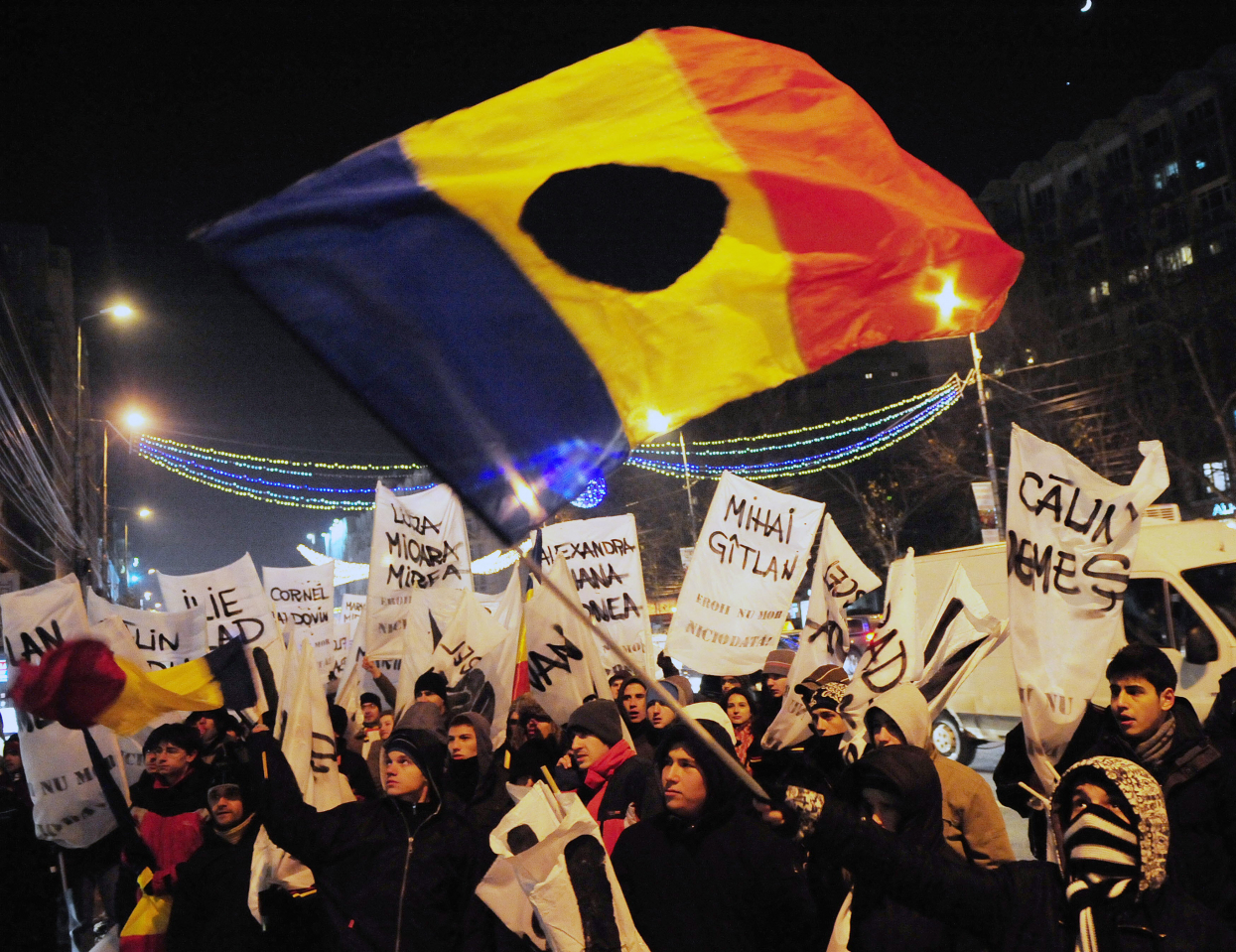 This photo shows a Romanian flag with a hole to symbolise the 1989 ...